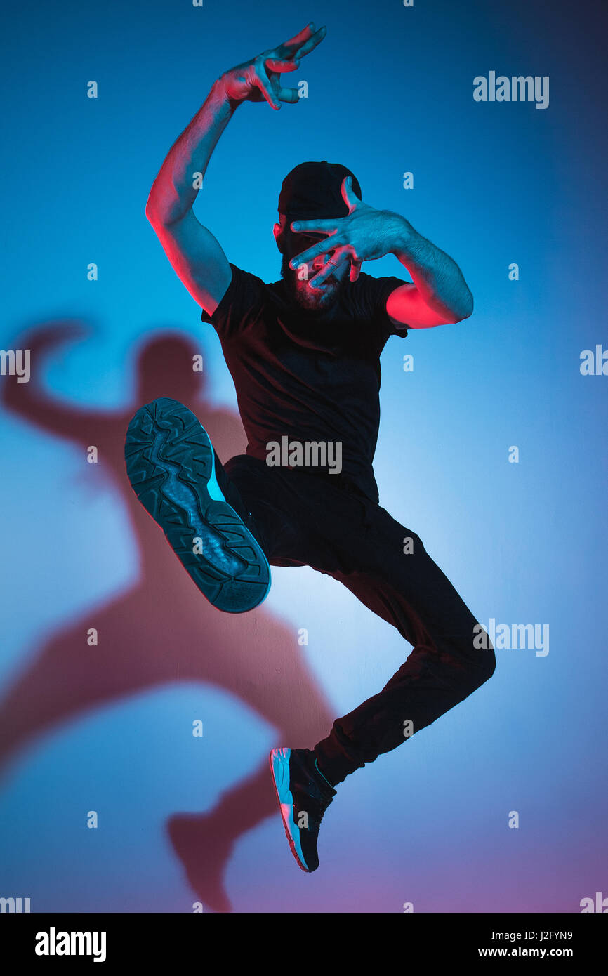 The silhouette of one young hip hop male break dancer dancing on ...