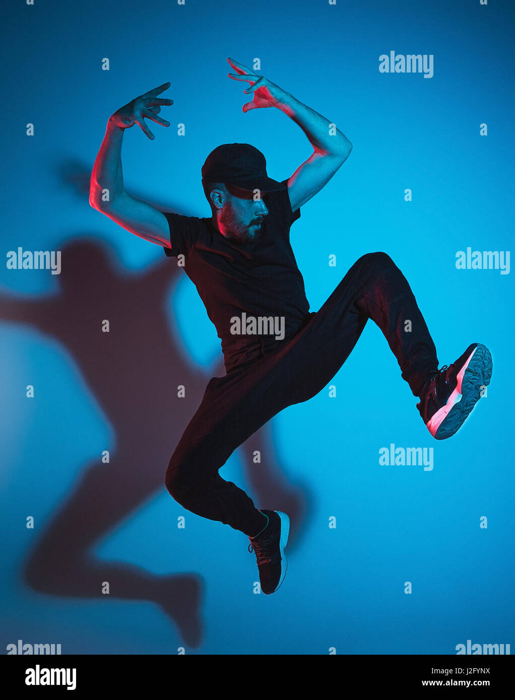 The silhouette of one young hip hop male break dancer dancing on ...