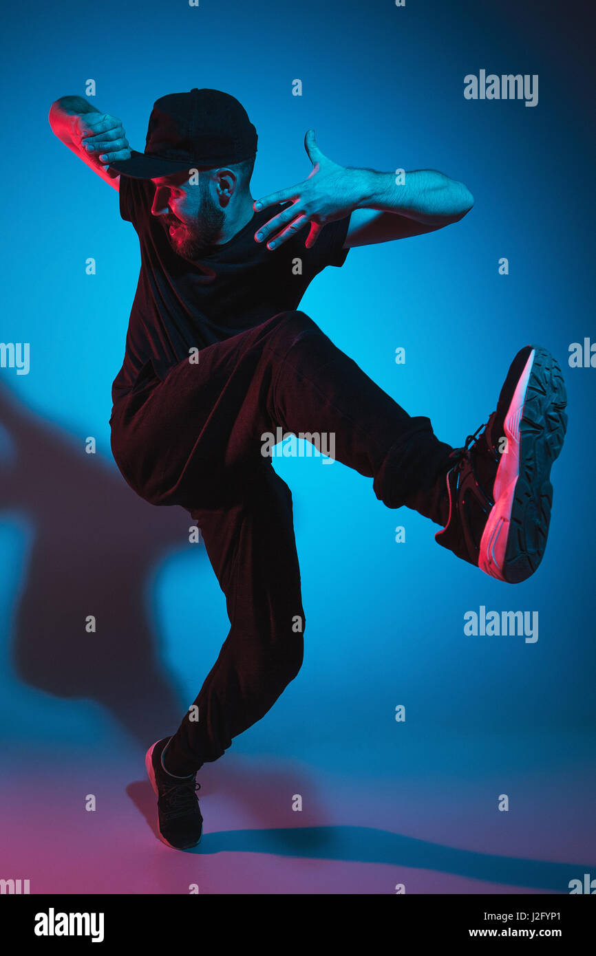 The silhouette of one young hip hop male break dancer dancing on ...