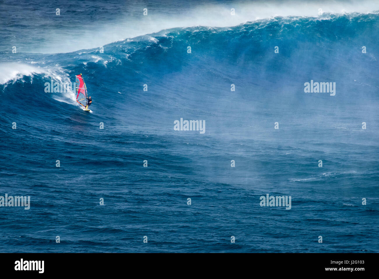 Hawaii maui lone windsurfer monster waves hi-res stock photography and ...