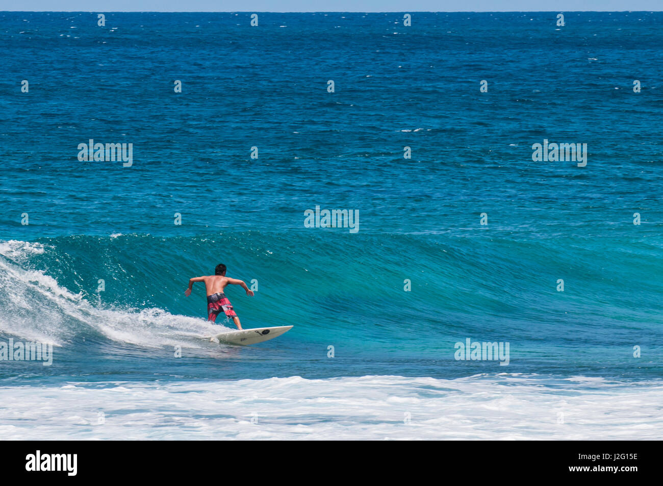 Surfing at Sunset Beach, North Shore, Oahu, Hawaii Stock Photo - Alamy