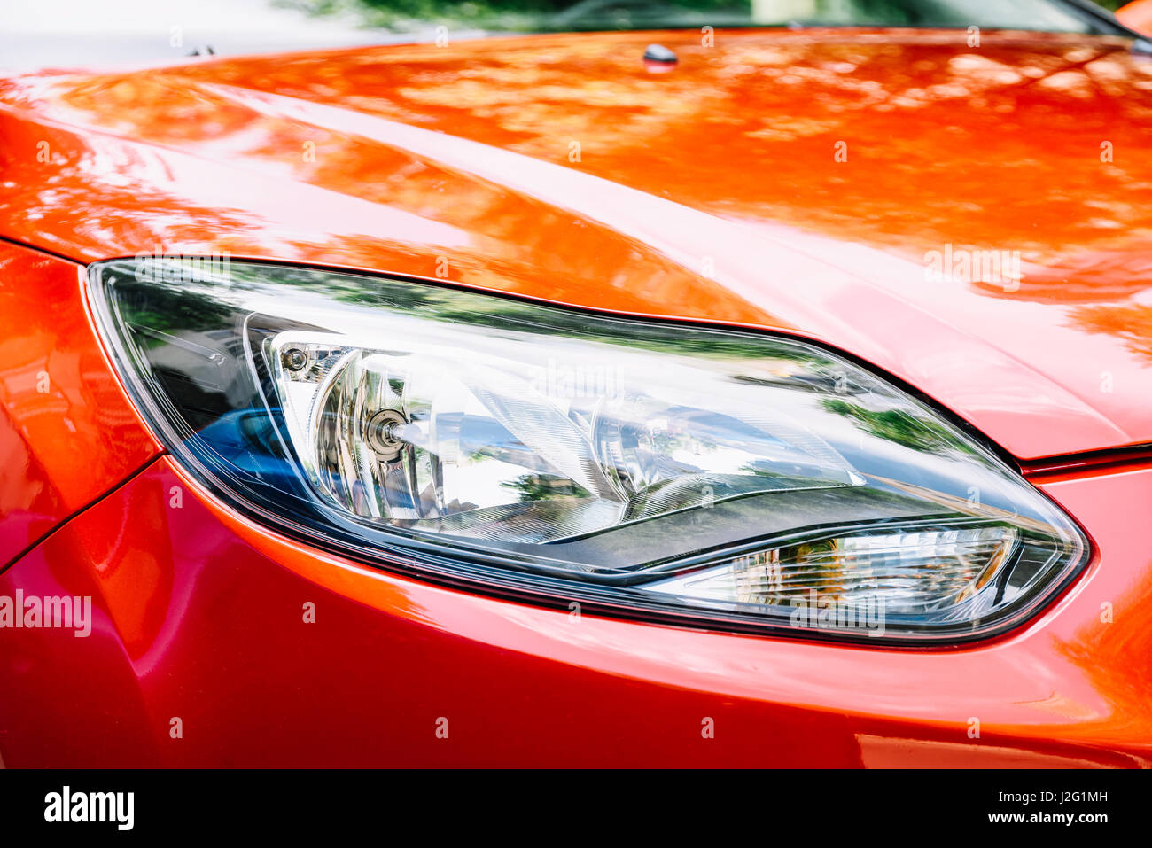Red Car Front Headlight View Stock Photo - Alamy