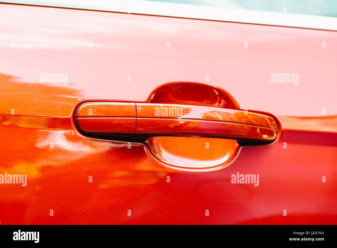 Red Car Door Handle Close Up Stock Photo - Alamy