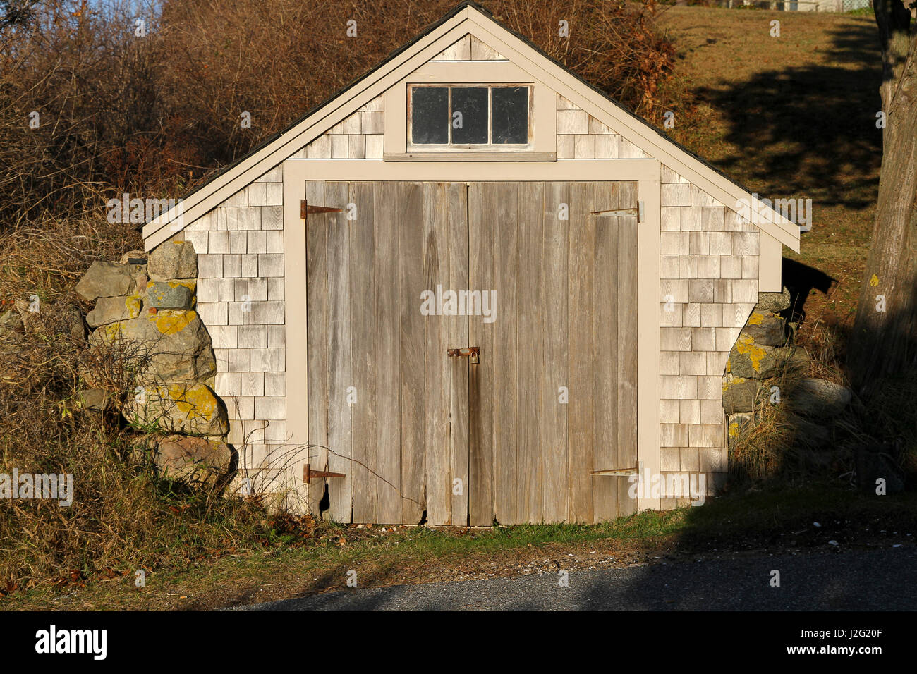 Shingled shed in late afternoon sunlight, Cape Cod, Massachusetts, USA ...