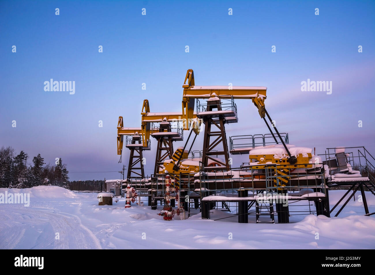 Oil and gas industry. winter landscape. Oil pumps. Oil industry ...