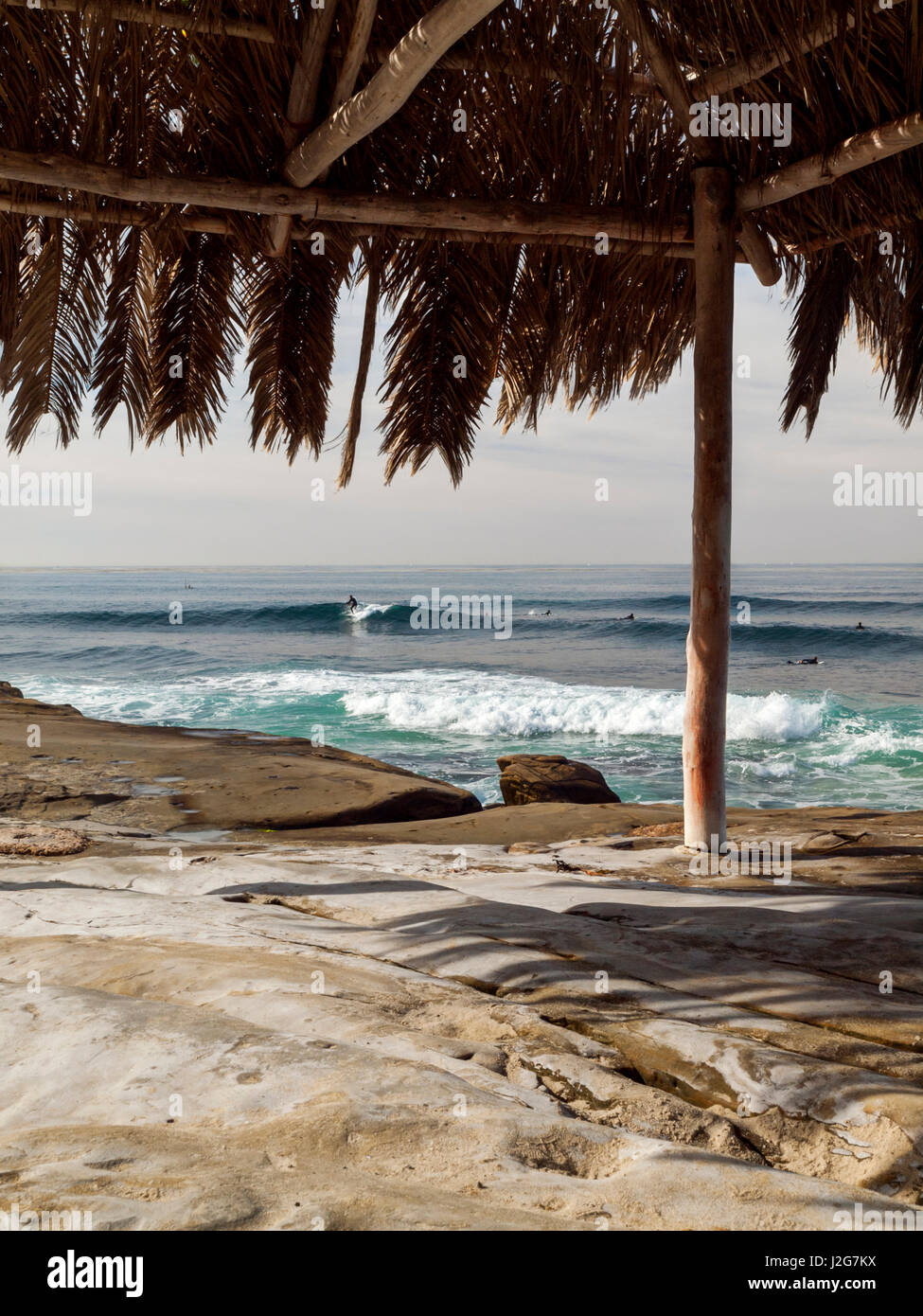 USA, California, La Jolla. Surf shack and surfers at Windansea Beach ...