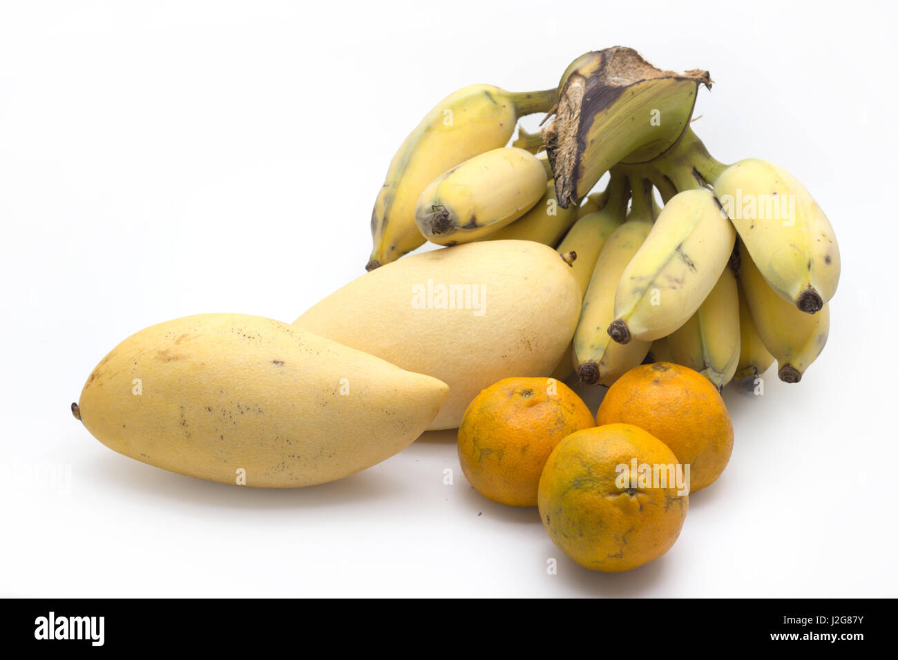 yellow fruit with mango orange and banana for nutrition Stock Photo - Alamy