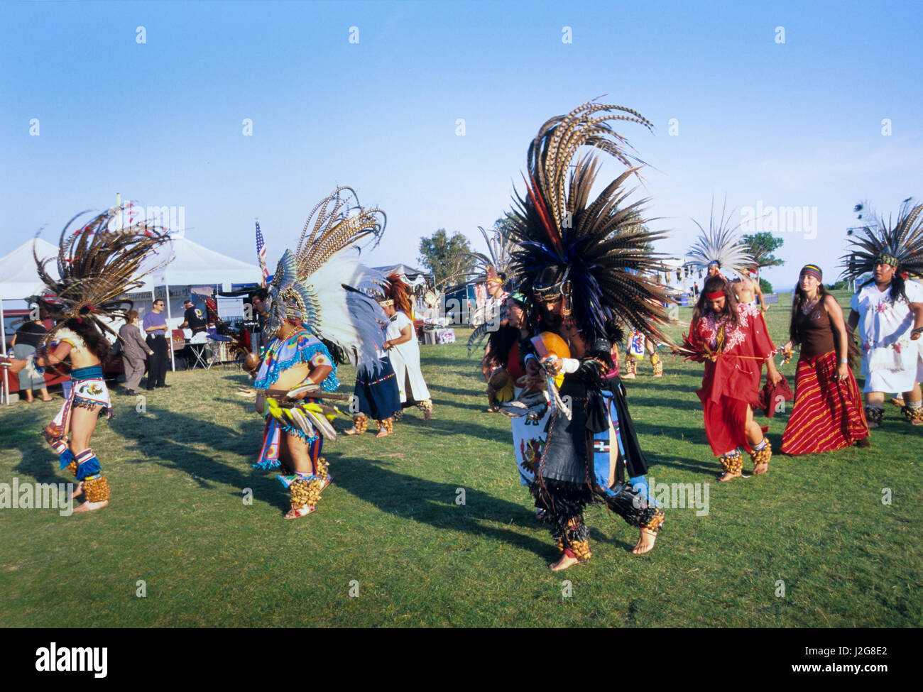 Large group of Aztec dancers display their traditions during a ...