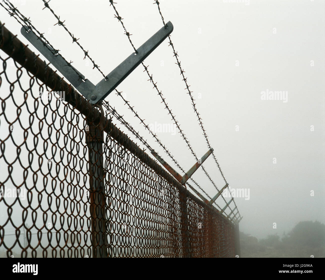 USA, California, wire mesh fence near Santa Ynez Mountains (Large ...