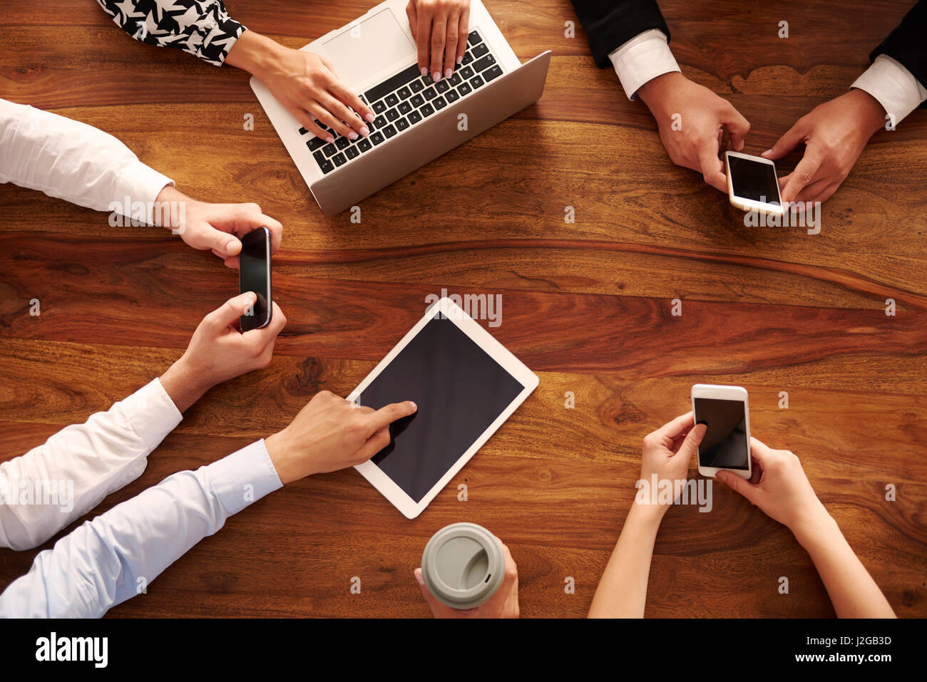 Group of business people using modern technology Stock Photo - Alamy