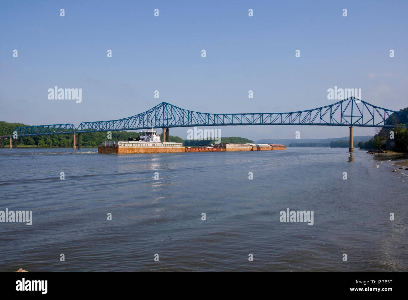 Barge under bridge on Mississippi River at Savanna, Illinois Stock ...