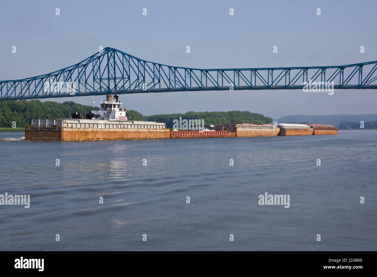 Barge under bridge on Mississippi River at Savanna, Illinois Stock ...