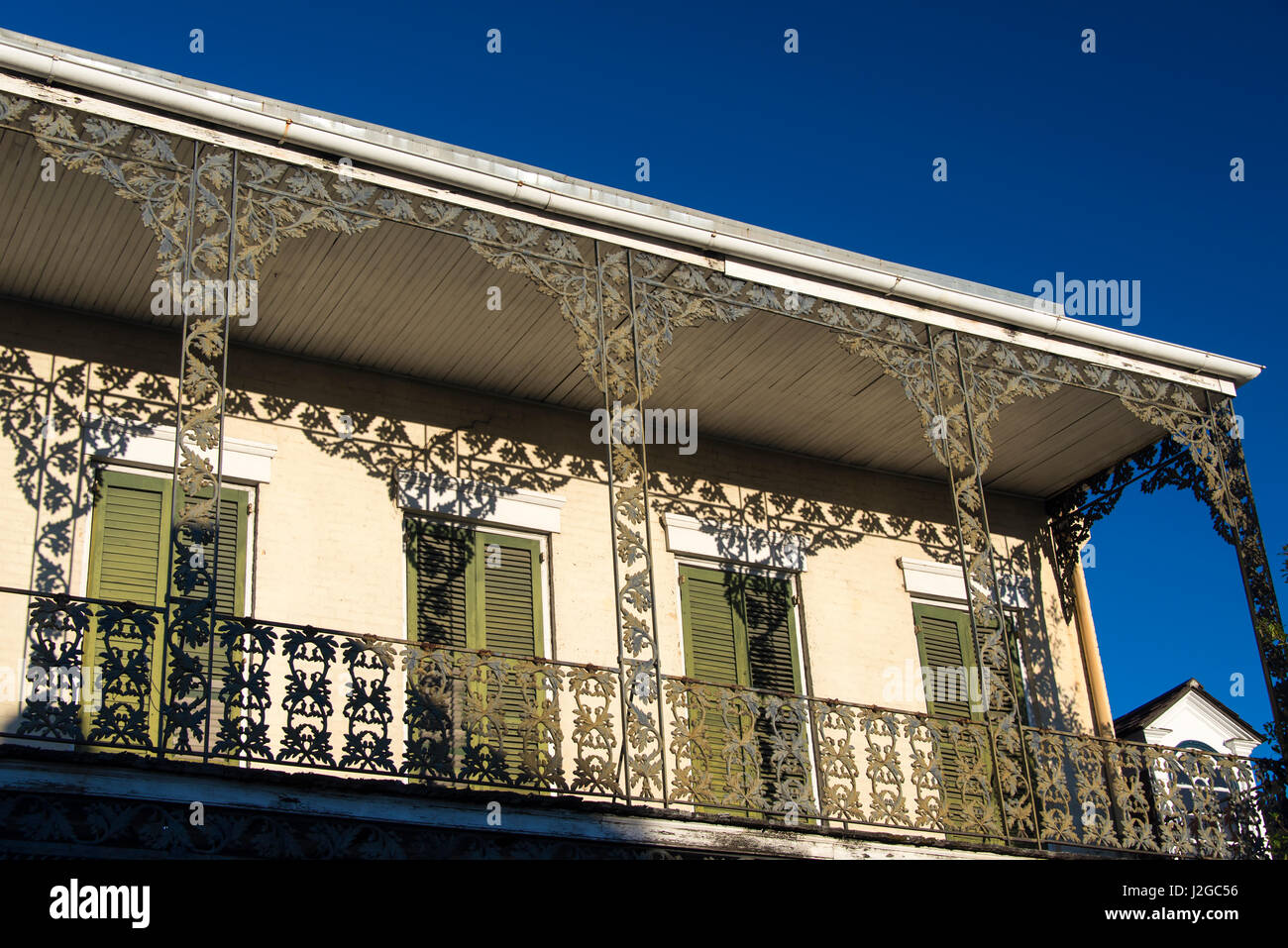 US, LA, New Orleans French Quarter. Early light creates shadow patterns ...