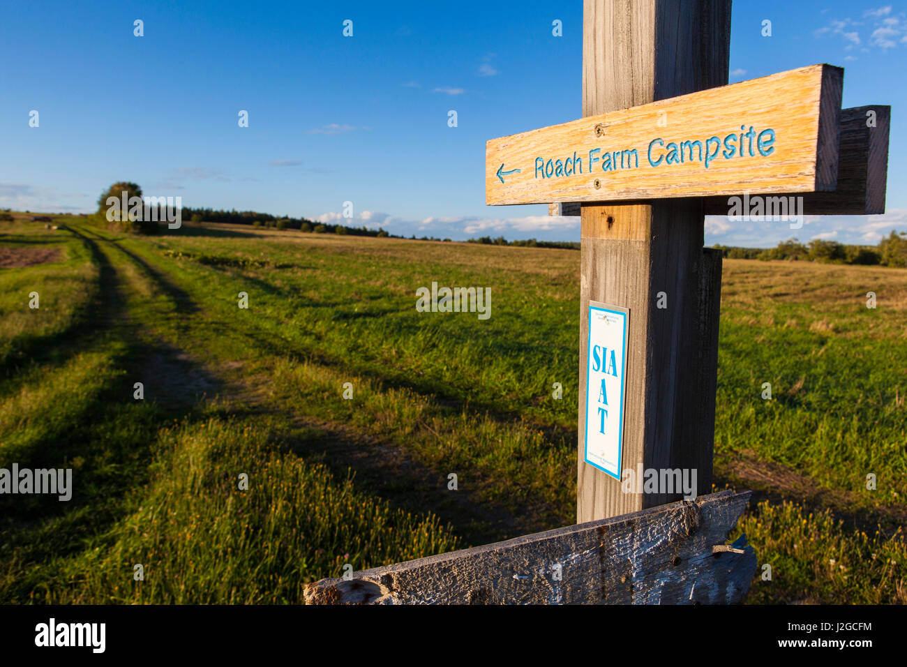 Trail sign showing the way to the Roach Farm Campsite on the ...