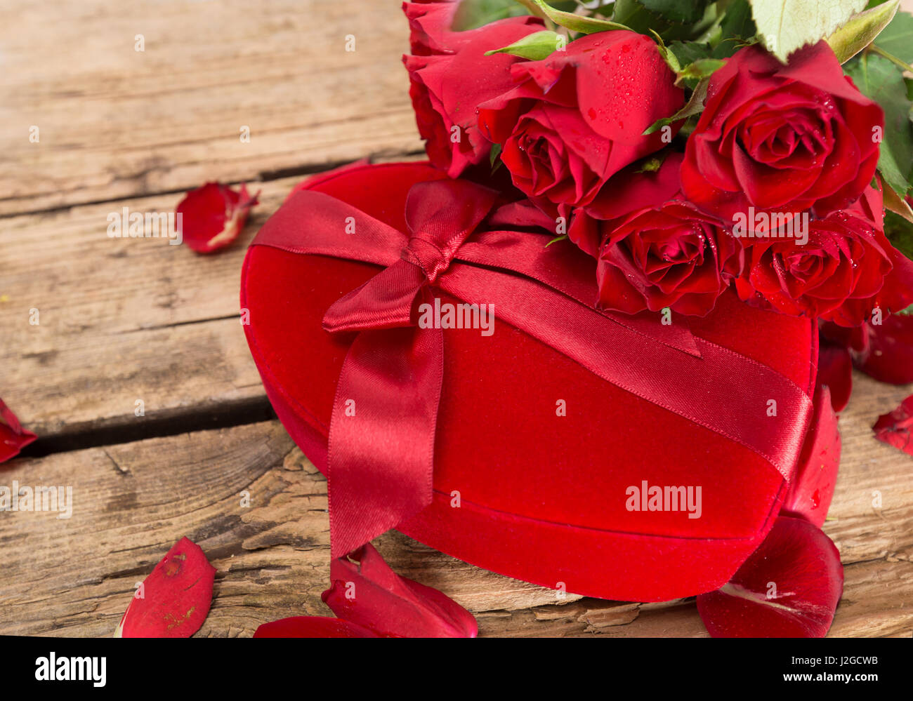 Perfect Valentines roses and heart shape present box Stock Photo - Alamy