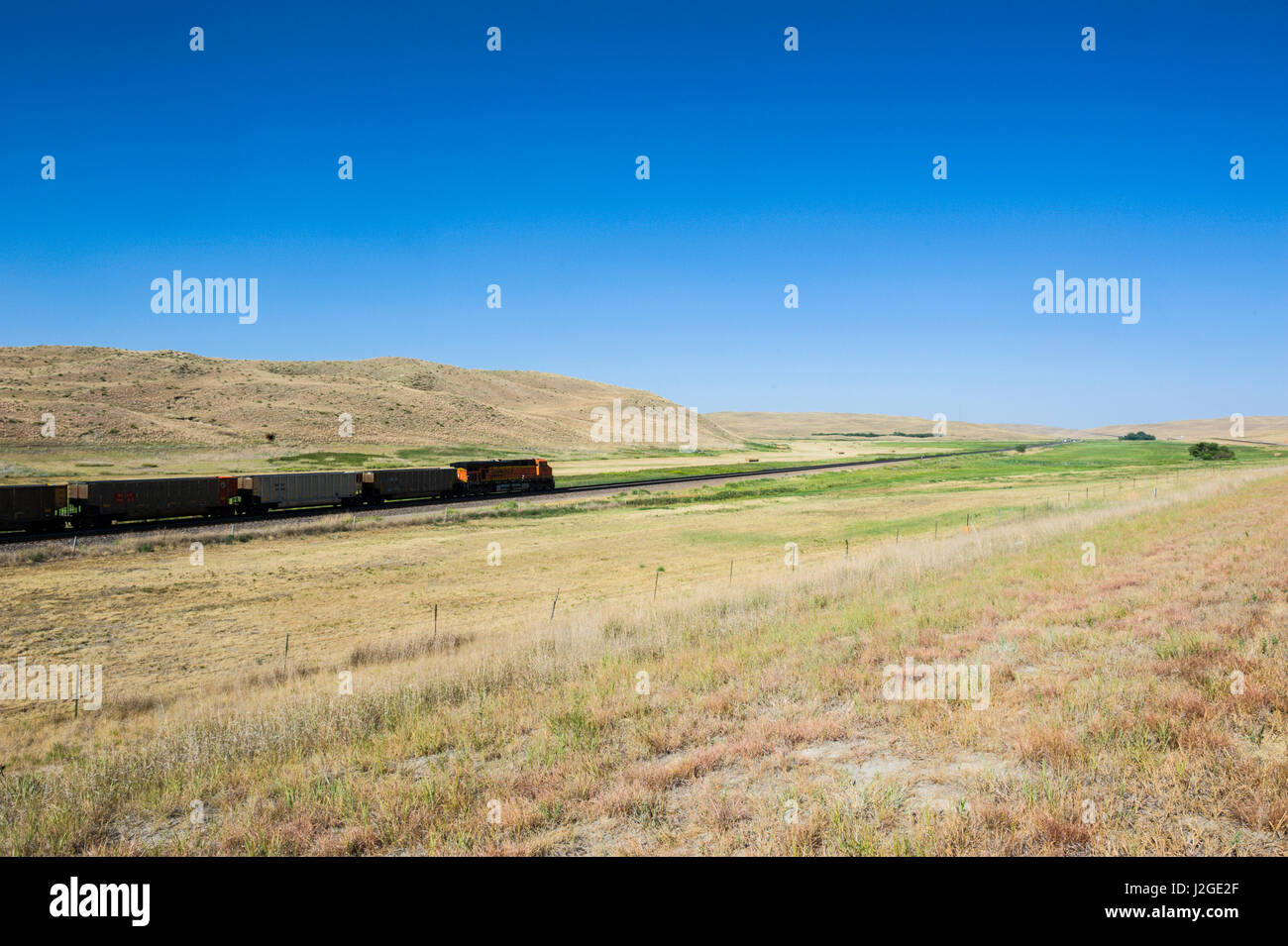 Cargo train rolling along the Route 2 through Nebraska, USA Stock Photo ...