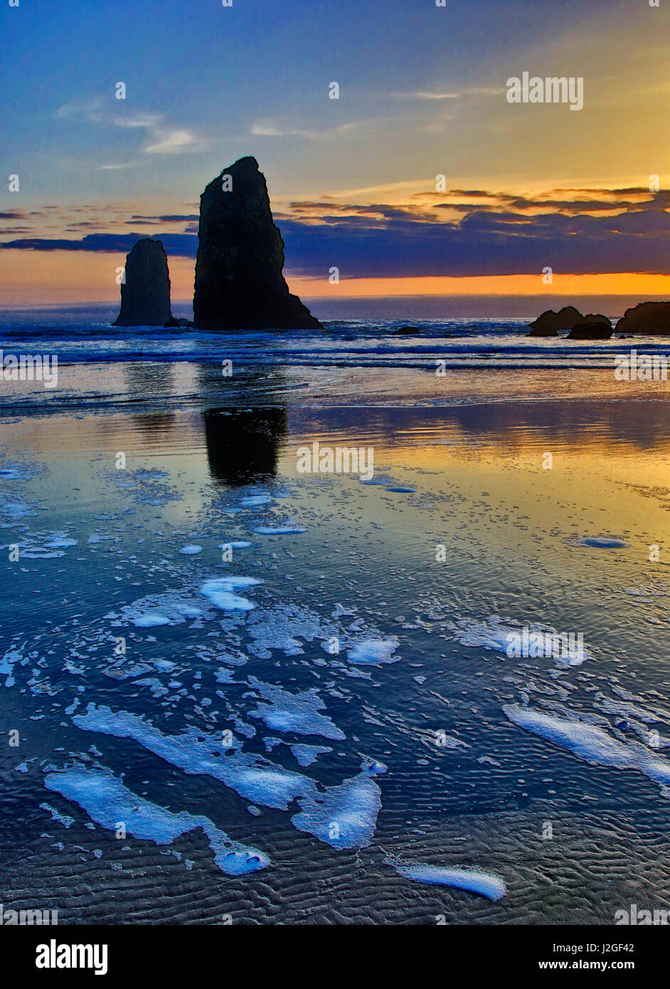 USA, Oregon, Cannon Beach. Sunset on The Sentinels seastacks. Credit as ...