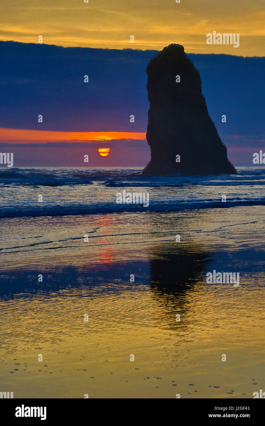USA, Oregon, Cannon Beach. Sunset on lone seastack. Credit as: Jean ...