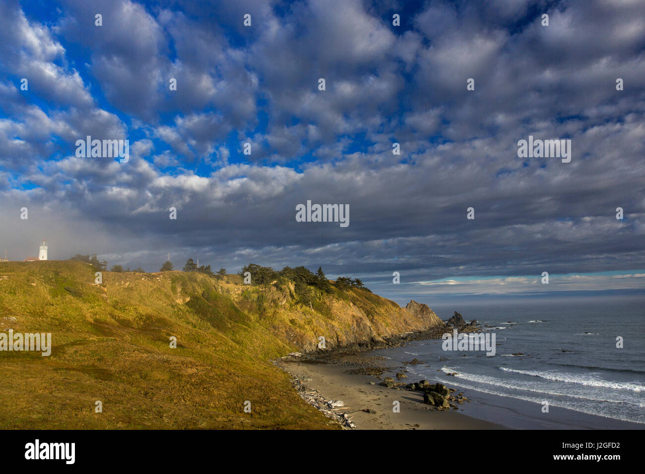 Morning light on the beach and lighthouse at Cape Blanco State Park ...