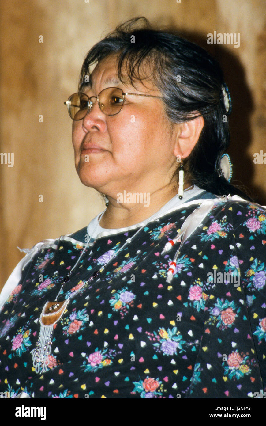 Close-up portrait of an Athabaskan woman in traditional clothing at the ...