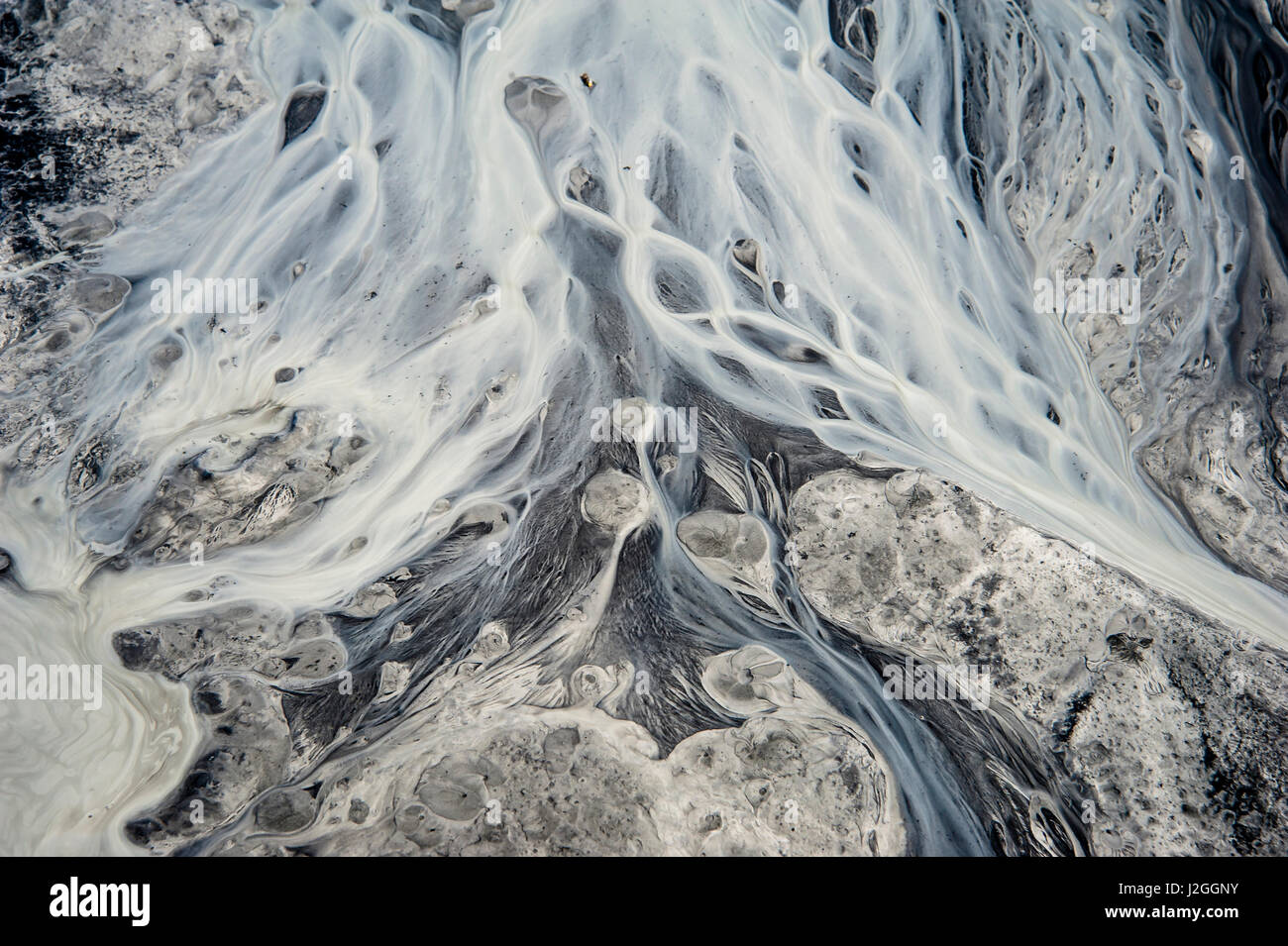 Rivulets of glacial melt water form this abstract Stock Photo - Alamy
