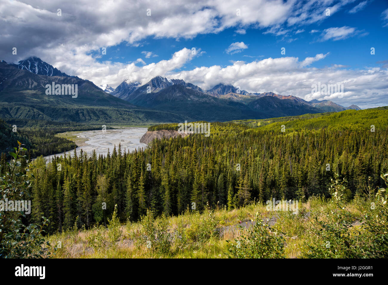 Glacial water melt river in valley in mountain range in Alaska (Large ...