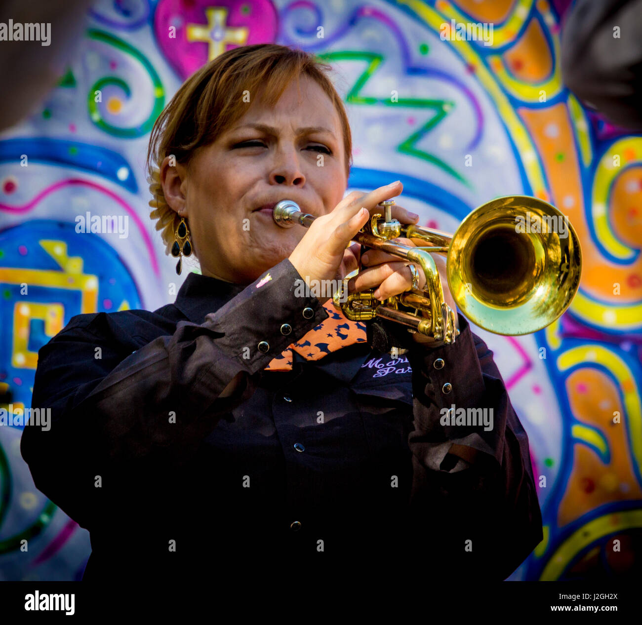 Woman playing trumpet hi-res stock photography and images - Alamy