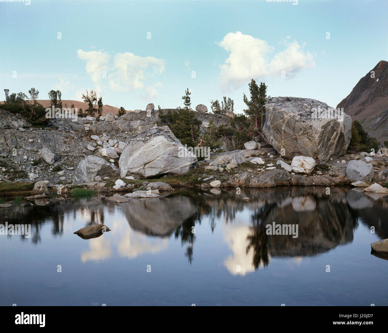 USA, California, Sierra Nevada Mountains, Glacial Till reflecting in a ...