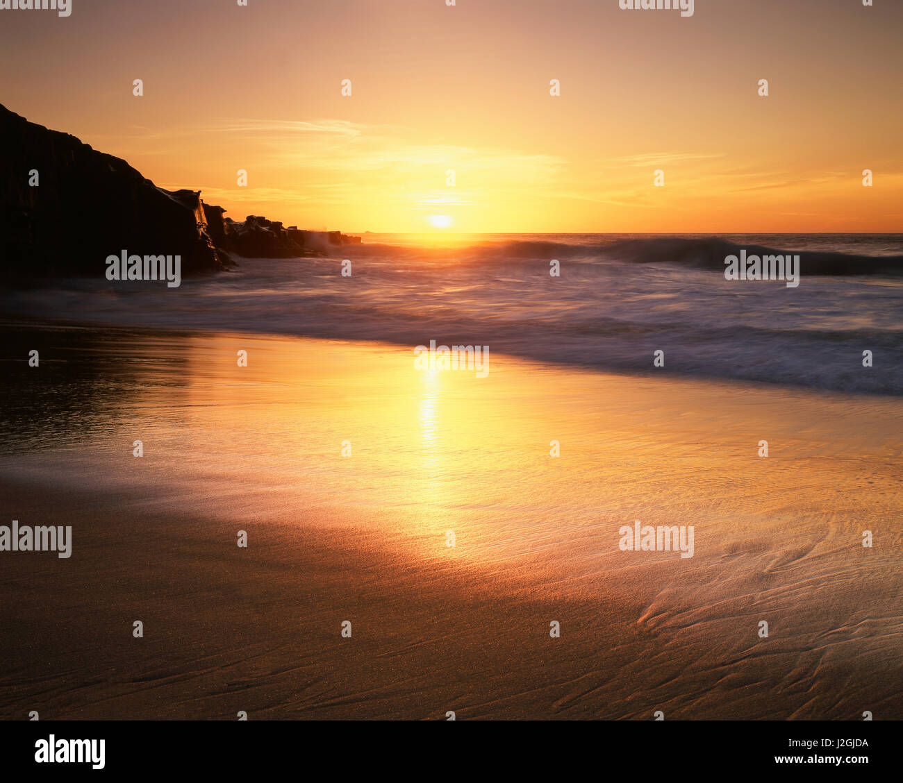 USA, California, La Jolla, Sunset over a beach and waves on the Pacific ...