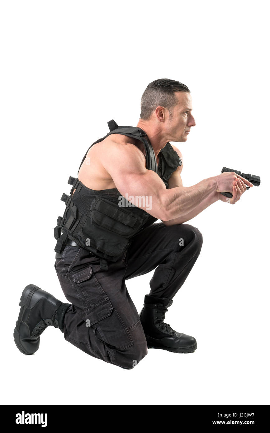 Man with tactical vest and gun isolated in white Stock Photo - Alamy