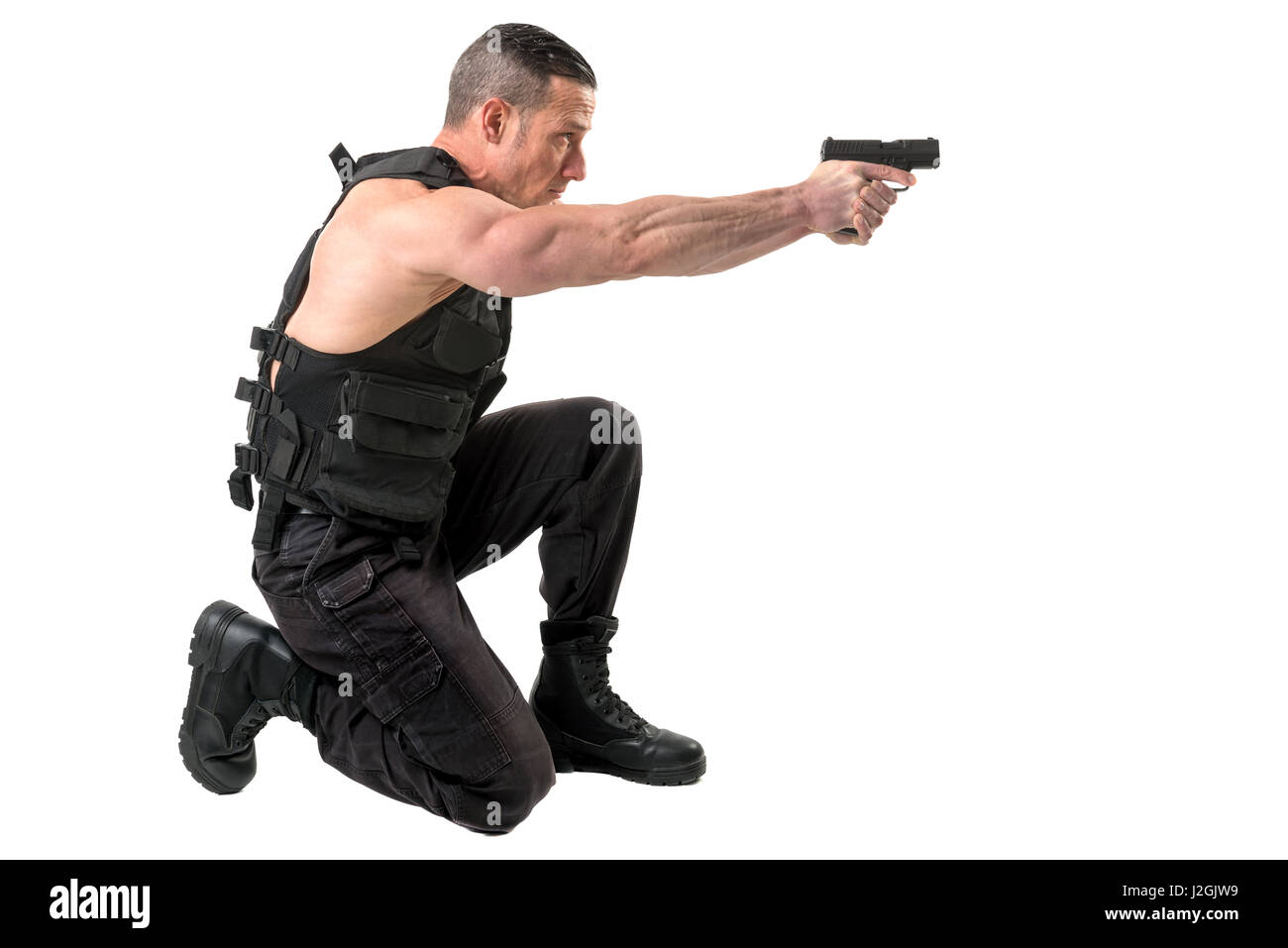 Man with tactical vest and gun isolated in white Stock Photo - Alamy