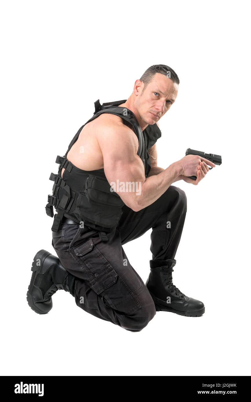 Man with tactical vest and gun isolated in white Stock Photo - Alamy