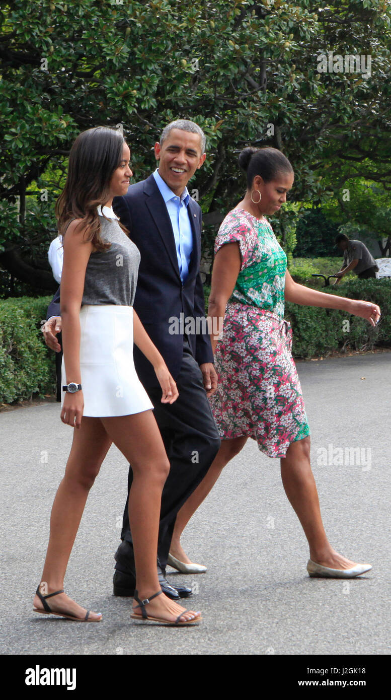 President Barack Obama, First Lady Michelle Obama and Malia Obama leave ...
