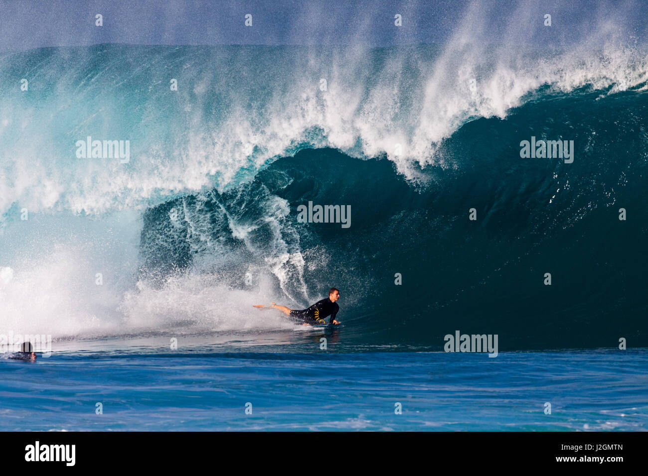 USA, Hawaii, Oahu, Surfers in Action at the Pipeline on the North Coast ...