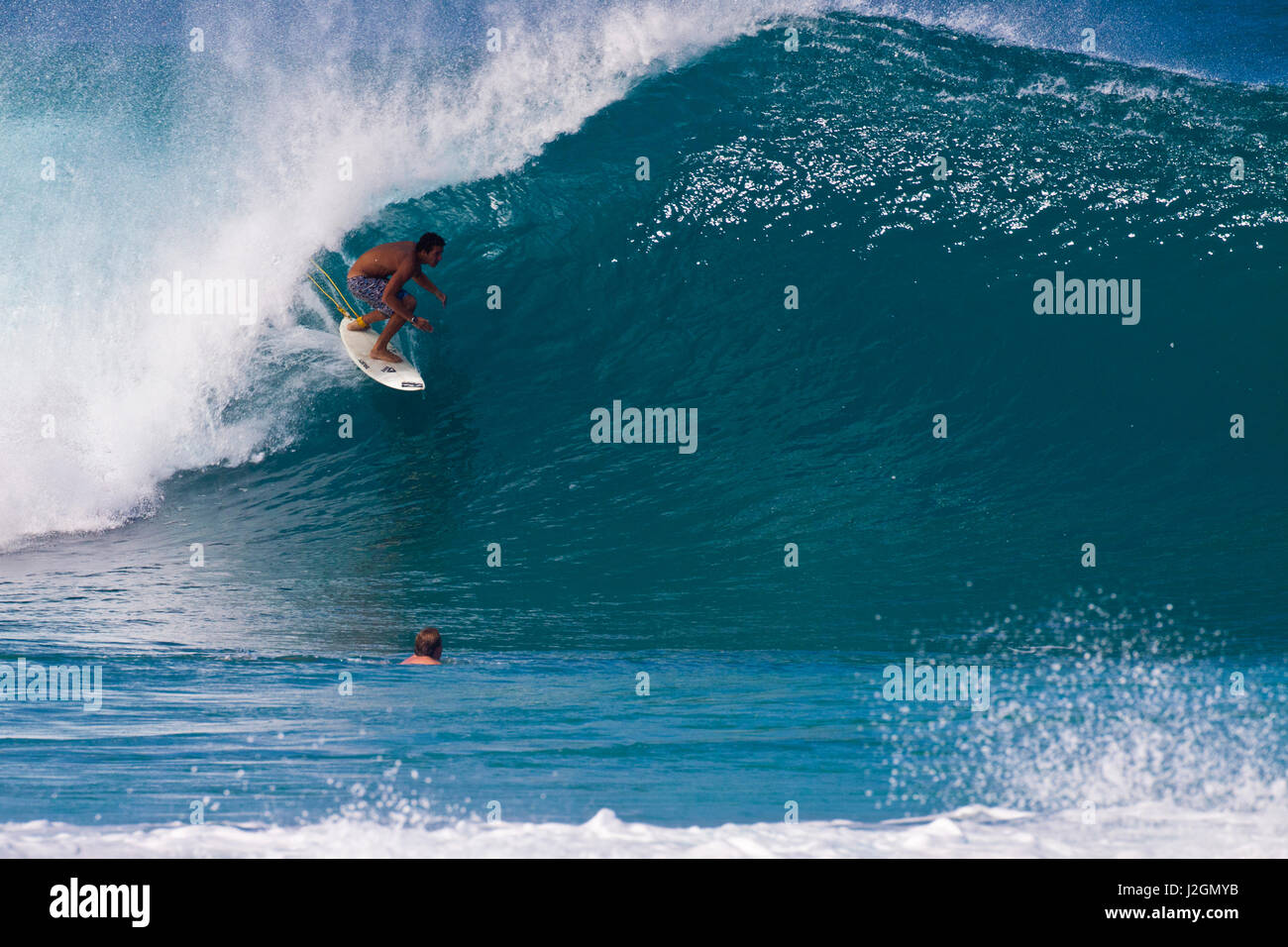 USA, Hawaii, Oahu, Surfers in Action at the Pipeline on the North Coast ...