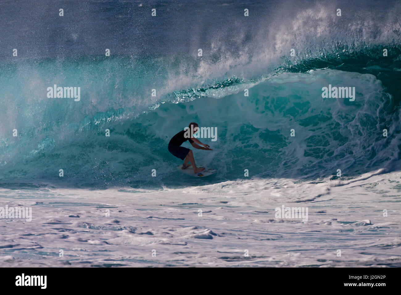 USA, Hawaii, Oahu, Surfers in Action at the Pipeline on the North Coast ...