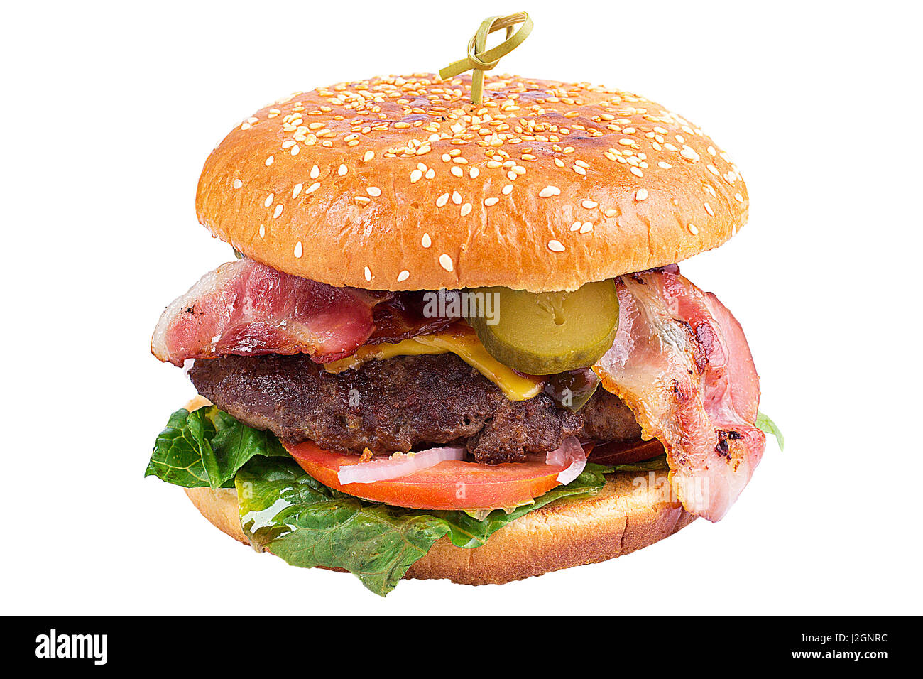 Big hamburger with meat and ham and fresh vegetables on a white ...