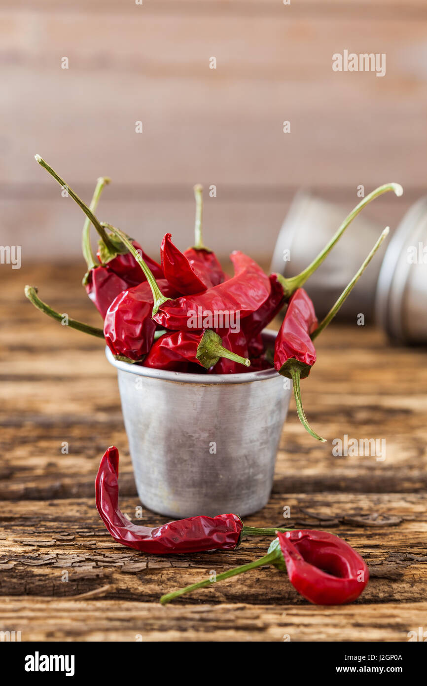 Dried chili peppers in a vintage metal container Stock Photo - Alamy