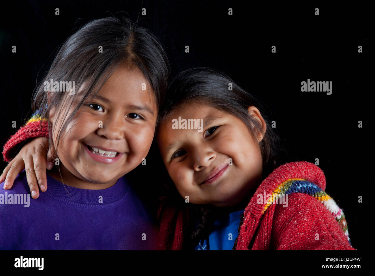 Close-up of two smiling contemporary Native American children ...