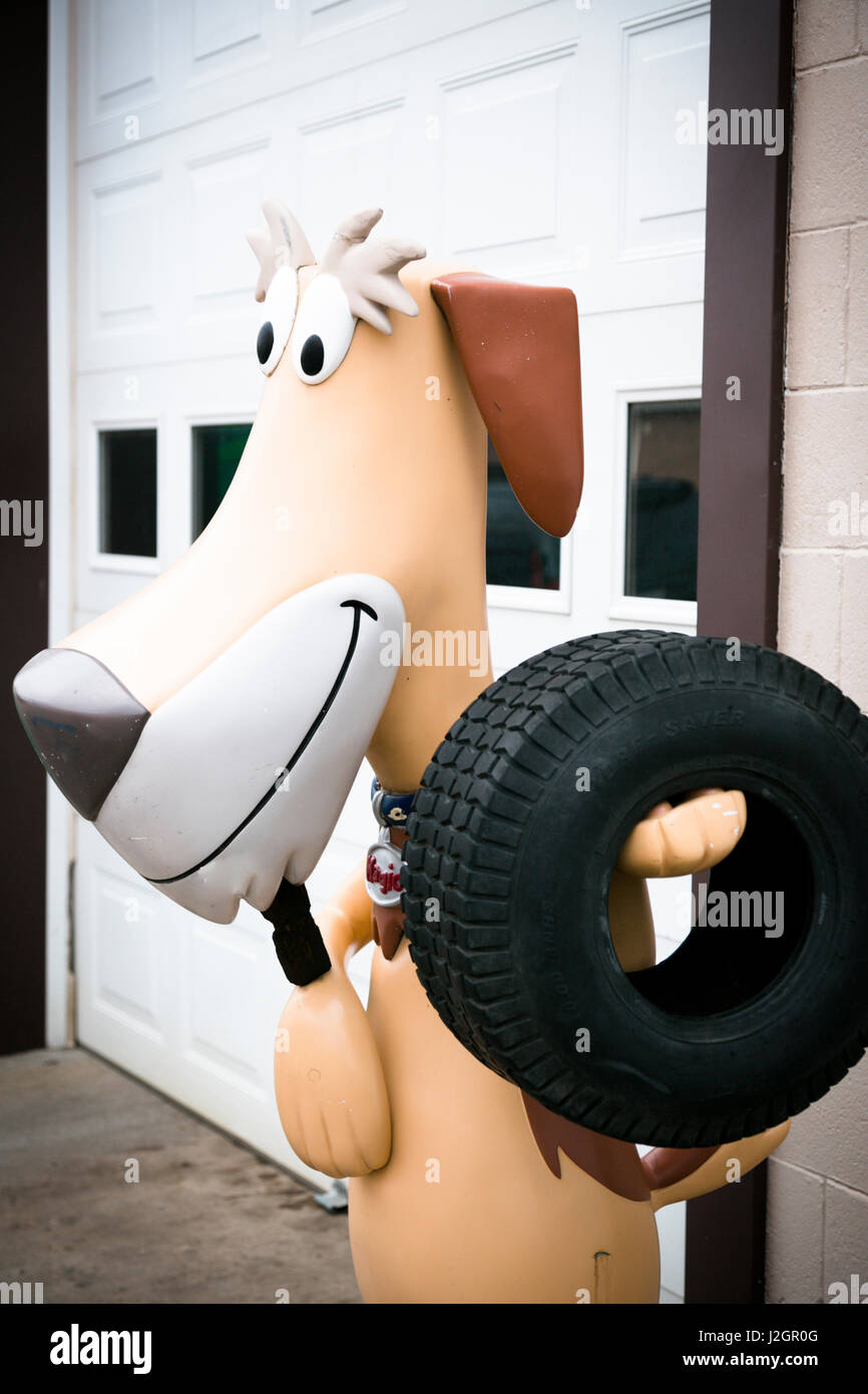 Cartoon dog sculpture holding a tire, Atlanta, Illinois, USA. Route 66 ...