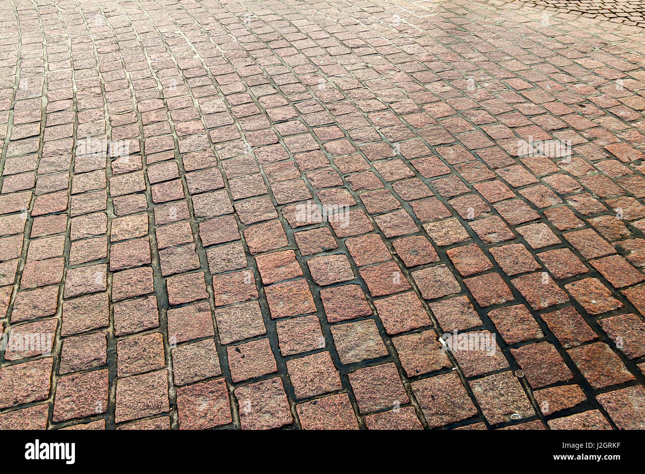 Stone pavement in perspective. Stone pavement texture. Granite ...