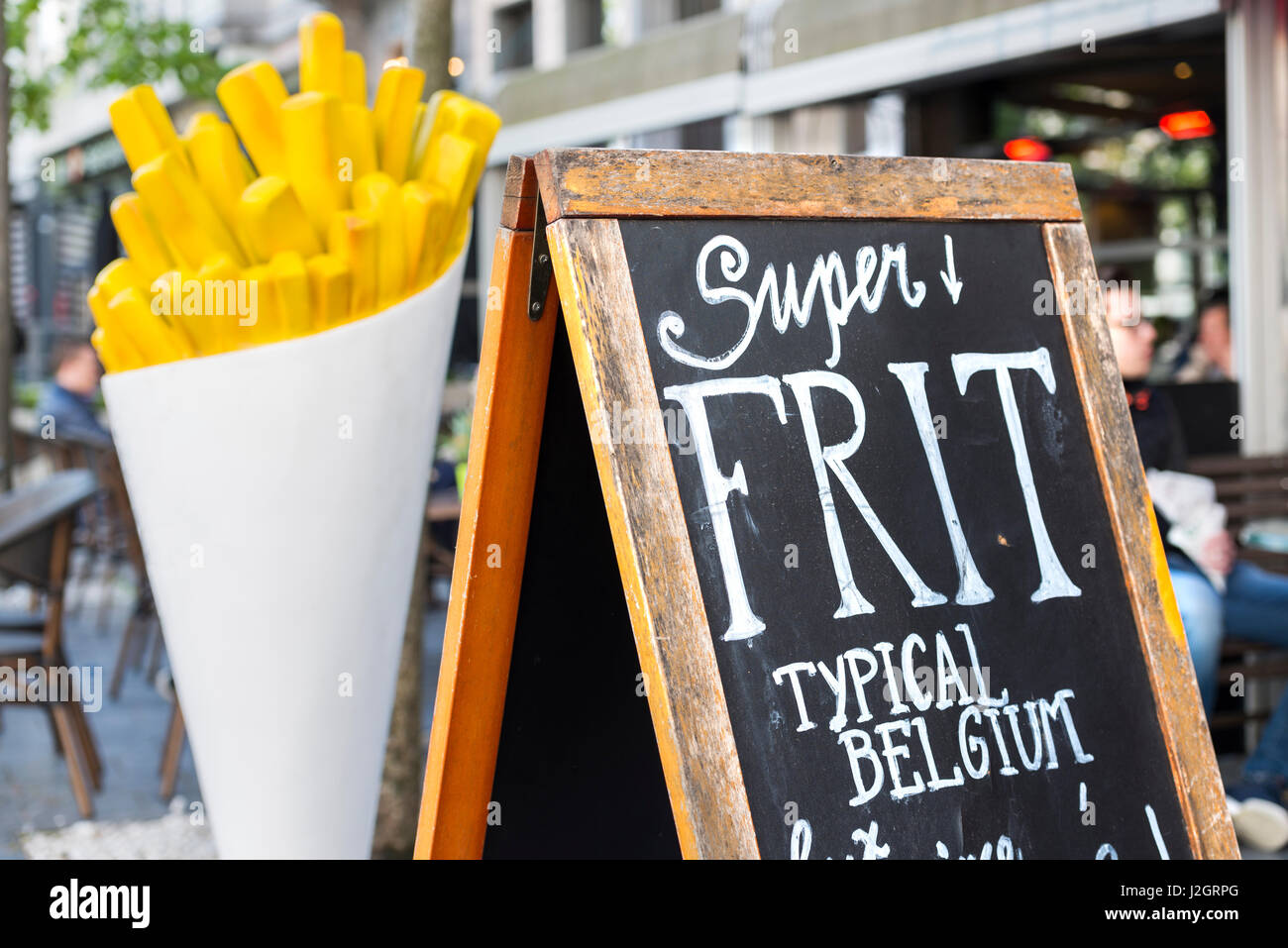 packet of fries at a typical Belgian chips store Stock Photo - Alamy