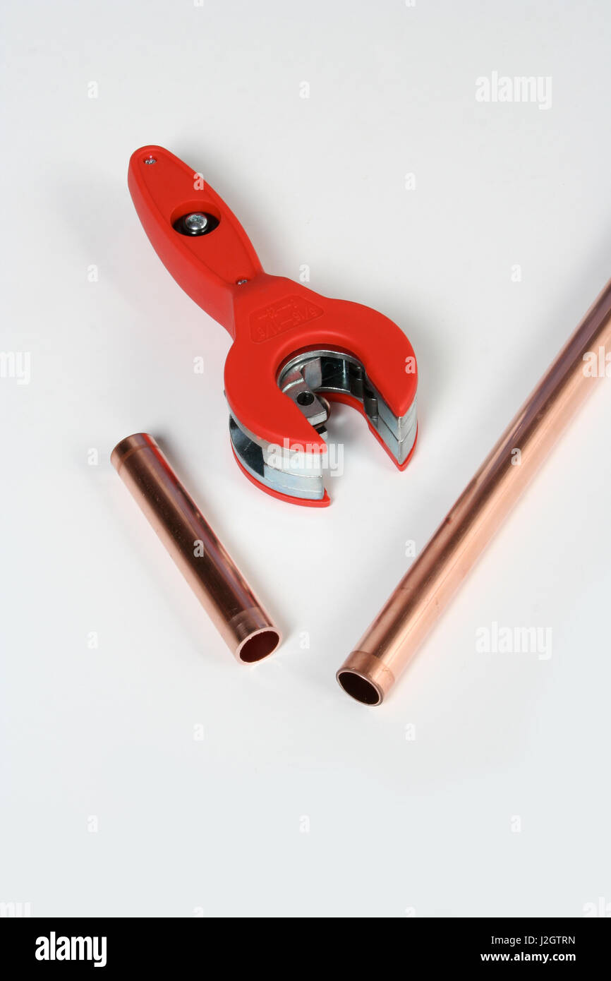 Pipe cutter and copper pipe as used by plumber Stock Photo - Alamy