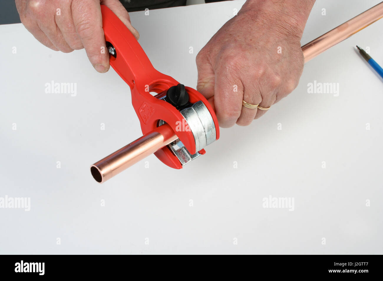 Pipe cutter and copper pipe as used by plumber Stock Photo - Alamy