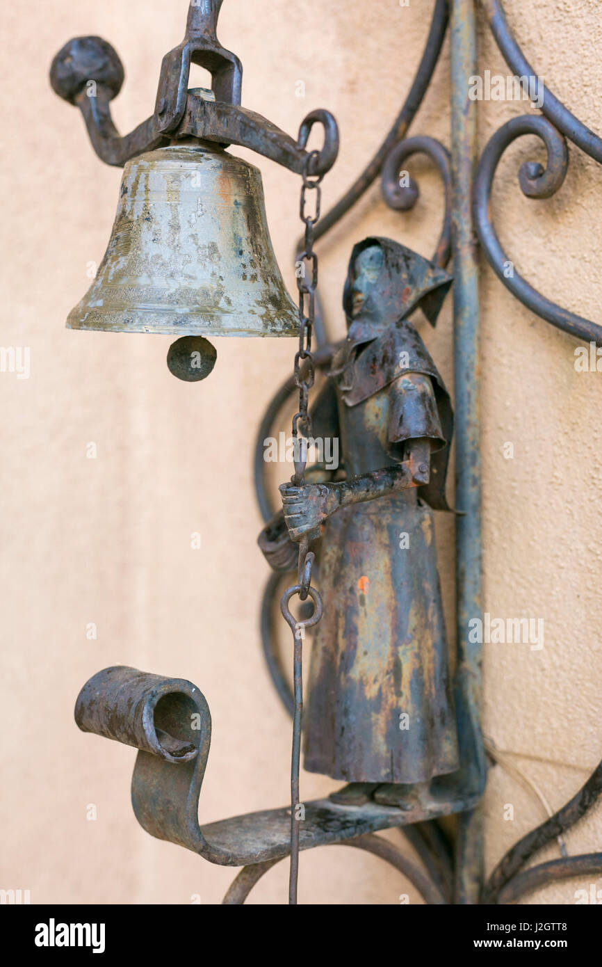 Unusual cast iron bell with a figurine, Taos, New Mexico, USA Stock ...