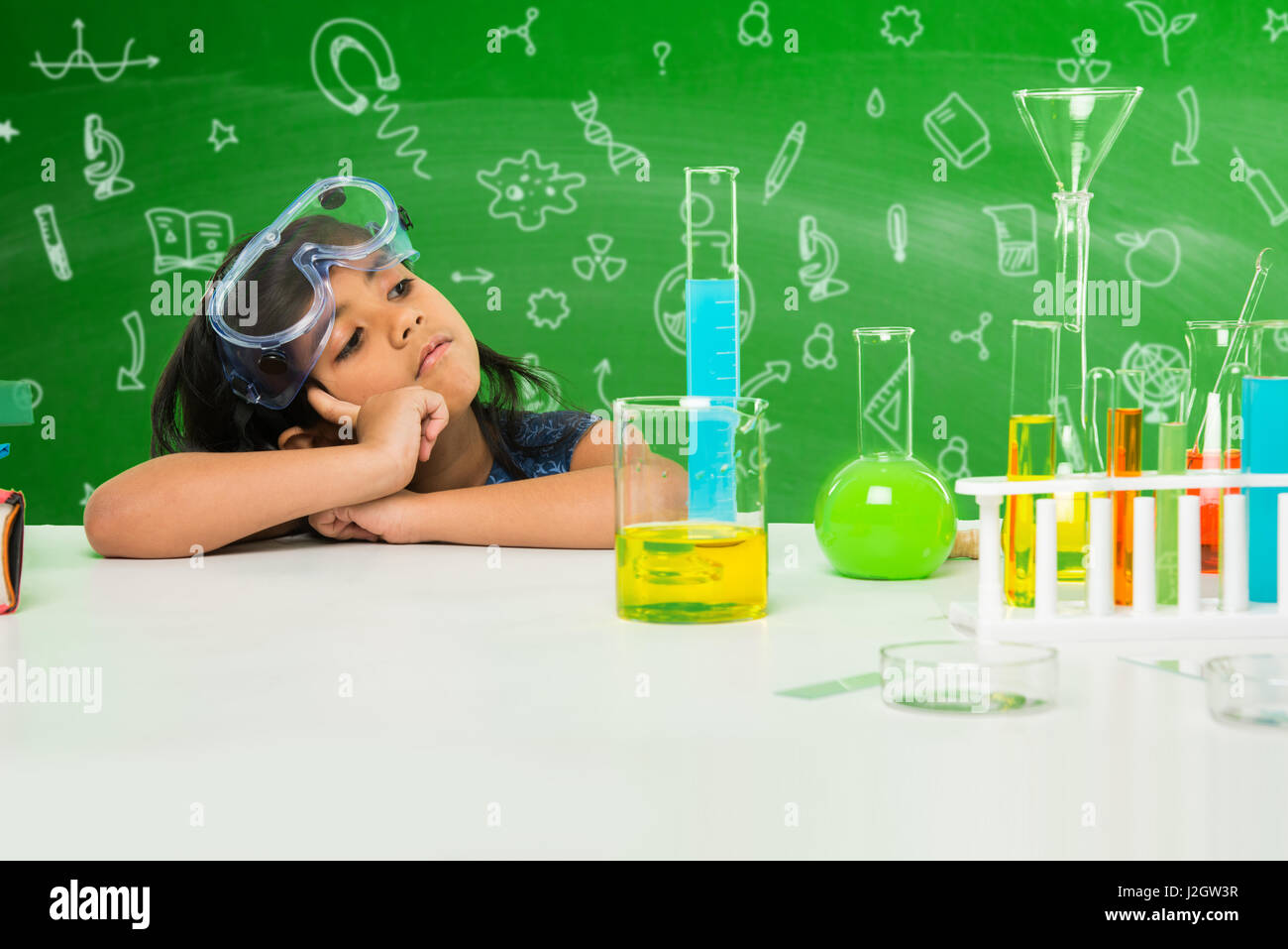 cute indian kids doing science experiment in chemistry lab or biology ...