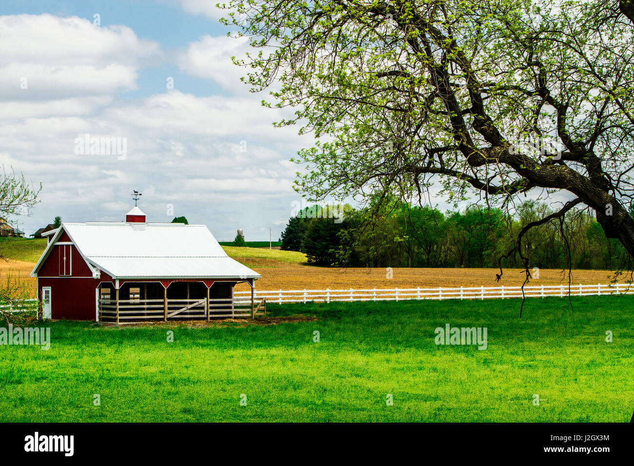 Lancaster County, Pennsylvania. Spring time, a red barn, green pastures ...