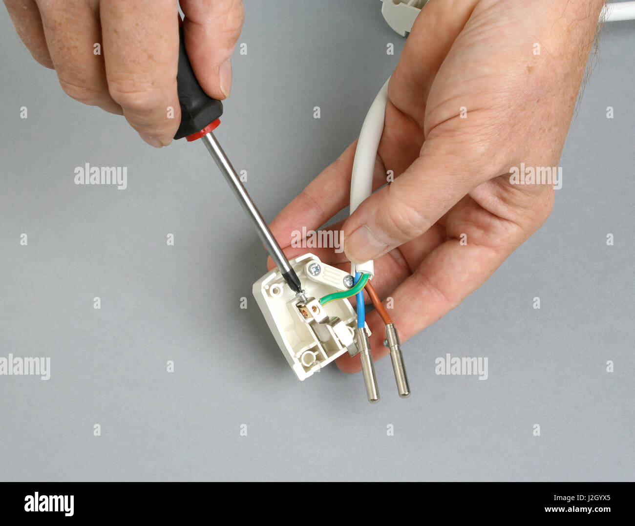 Repairing an electrical plug Stock Photo - Alamy
