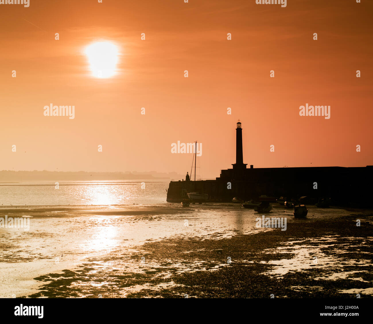Margate lighthouse silhouetted against a sunset Stock Photo - Alamy