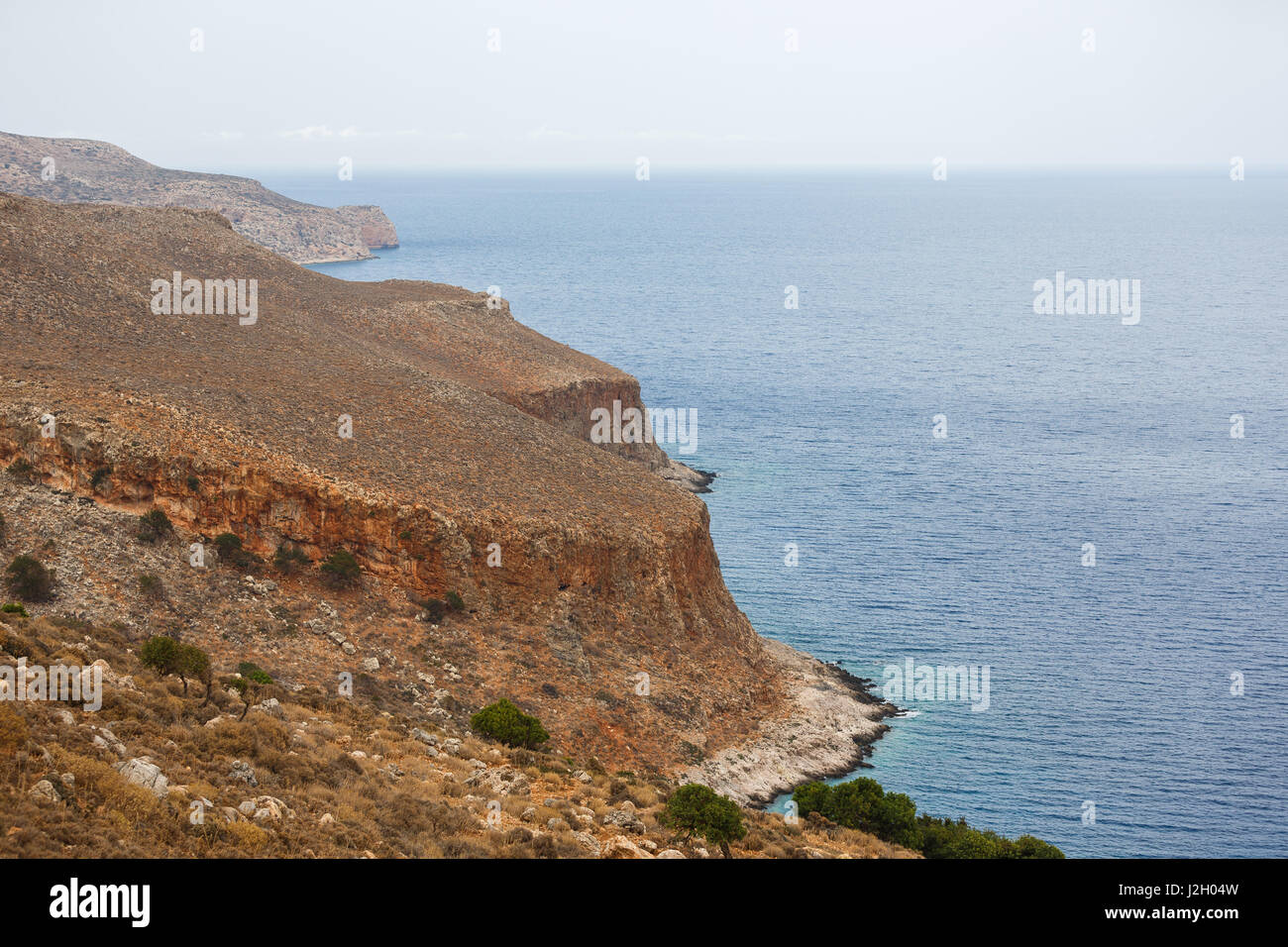 High rocky shore of the island of Crete Stock Photo - Alamy